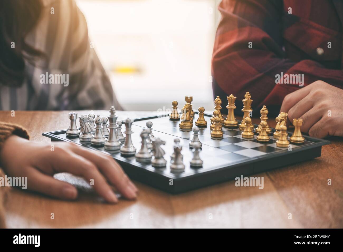 Closeup image of people playing chessboard game together Stock Photo ...