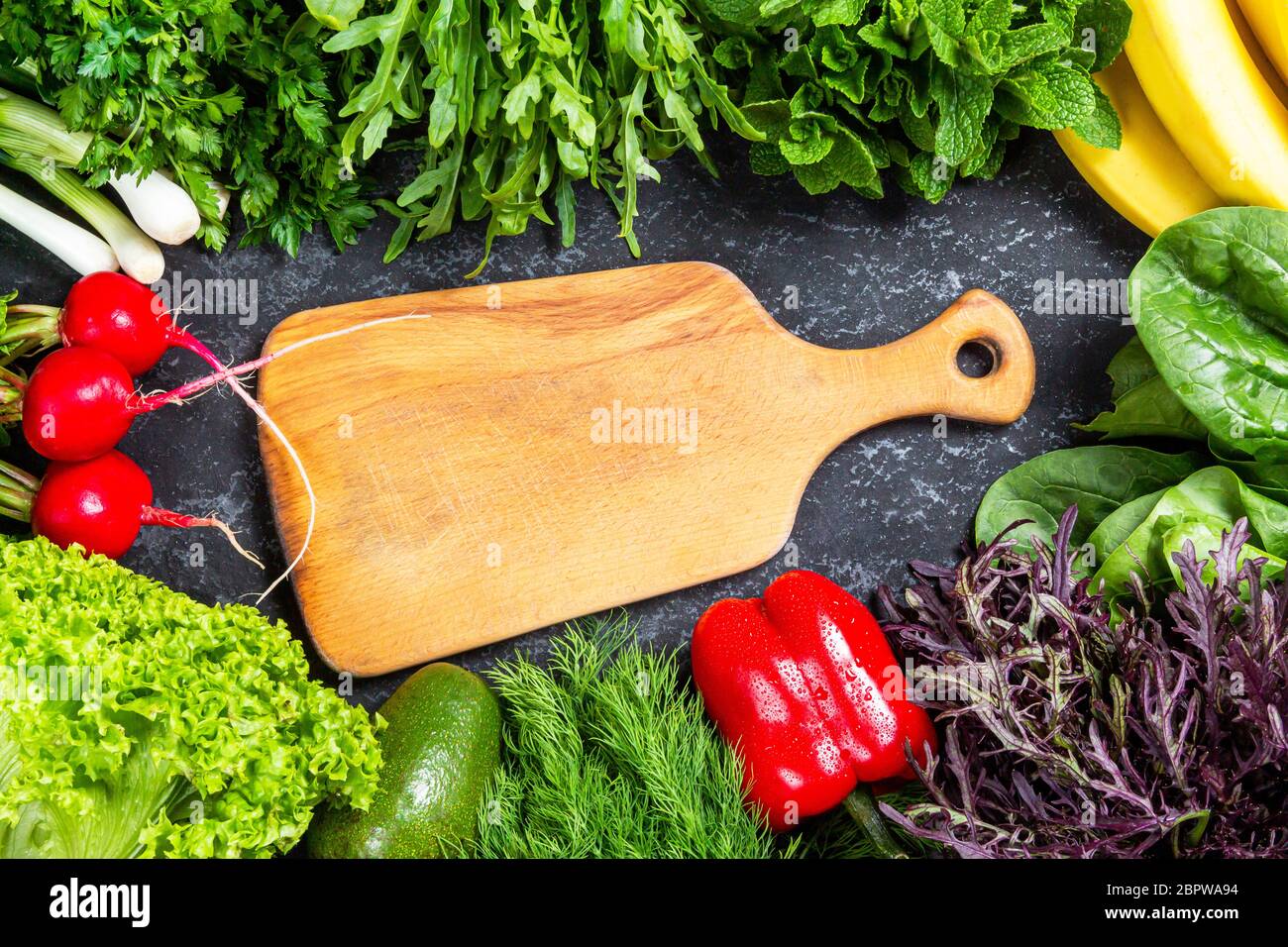 Vegan Menu Concept. Wooden rustic cutting board with ingredients for ...