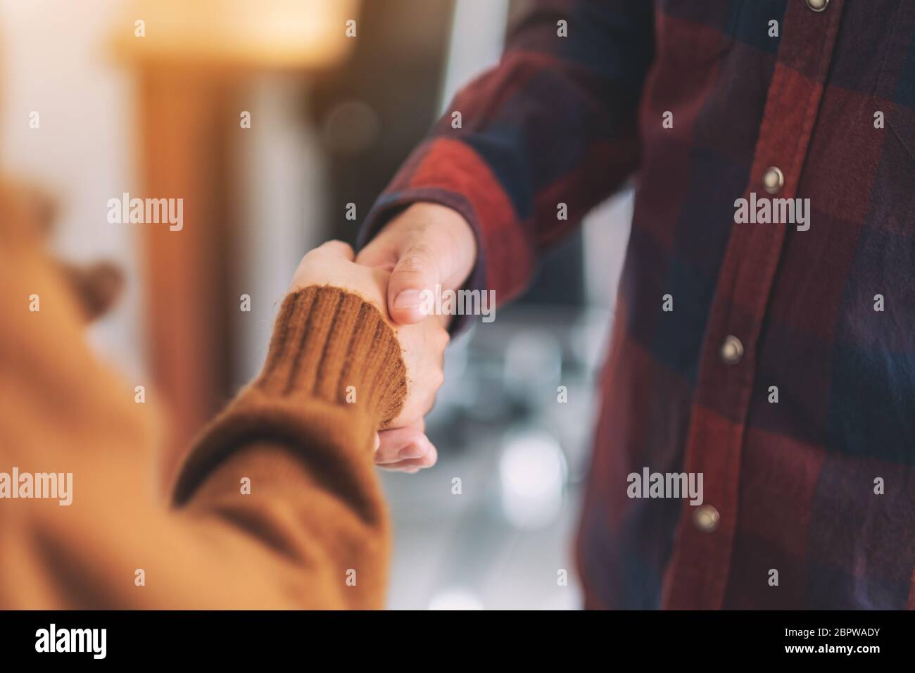 Closeup image of two people shaking hands Stock Photo - Alamy