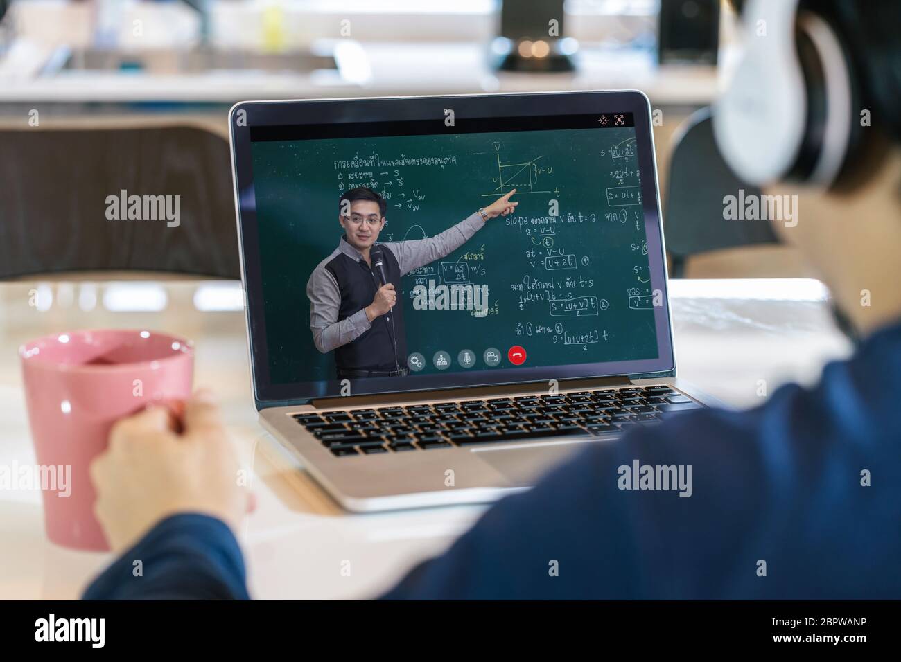 Rear View of Asian student learning with teacher over the physics ...