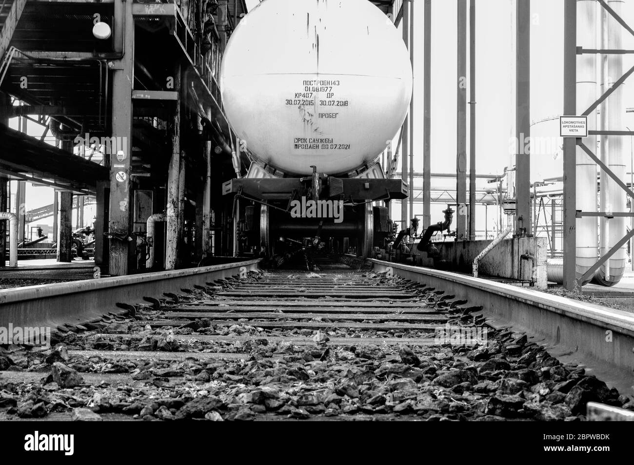 Oil train wagons on oil refinery Stock Photo - Alamy