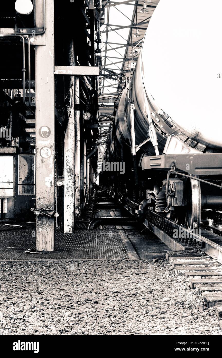 Oil train wagons on oil refinery Stock Photo - Alamy