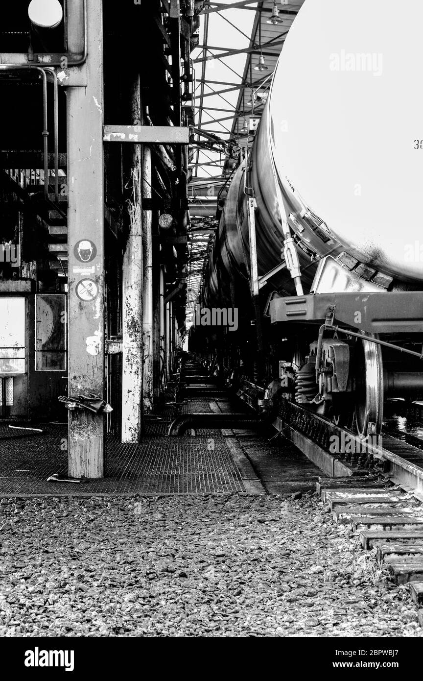 Oil train wagons on oil refinery Stock Photo - Alamy