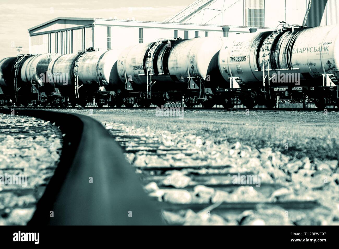 Oil train wagons on oil refinery Stock Photo - Alamy