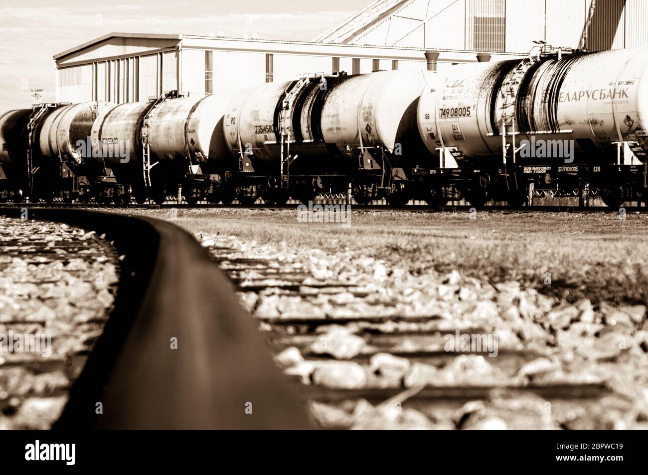 Oil train wagons on oil refinery Stock Photo - Alamy