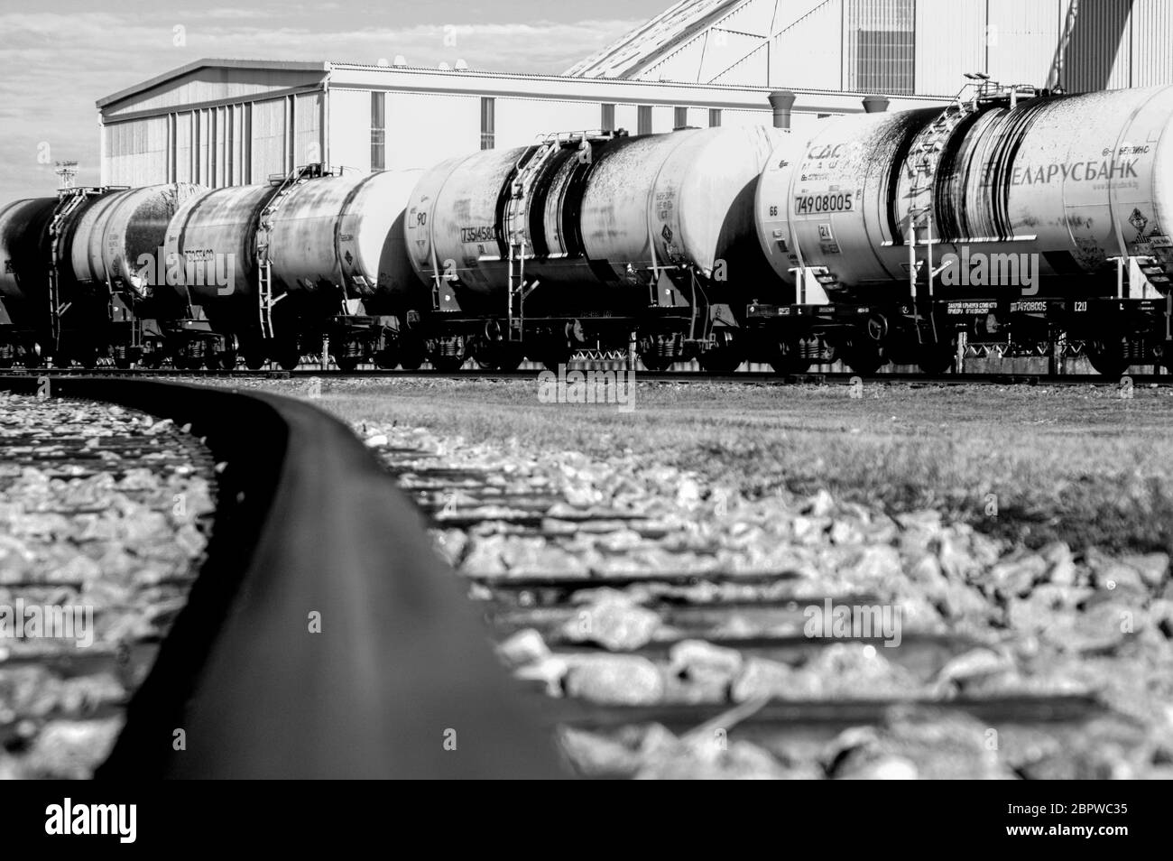 Oil train wagons on oil refinery Stock Photo - Alamy