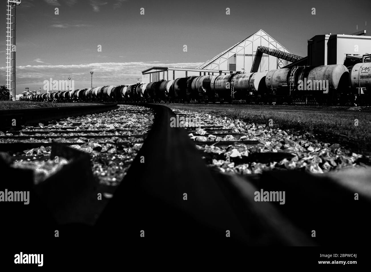 Oil train wagons on oil refinery Stock Photo - Alamy