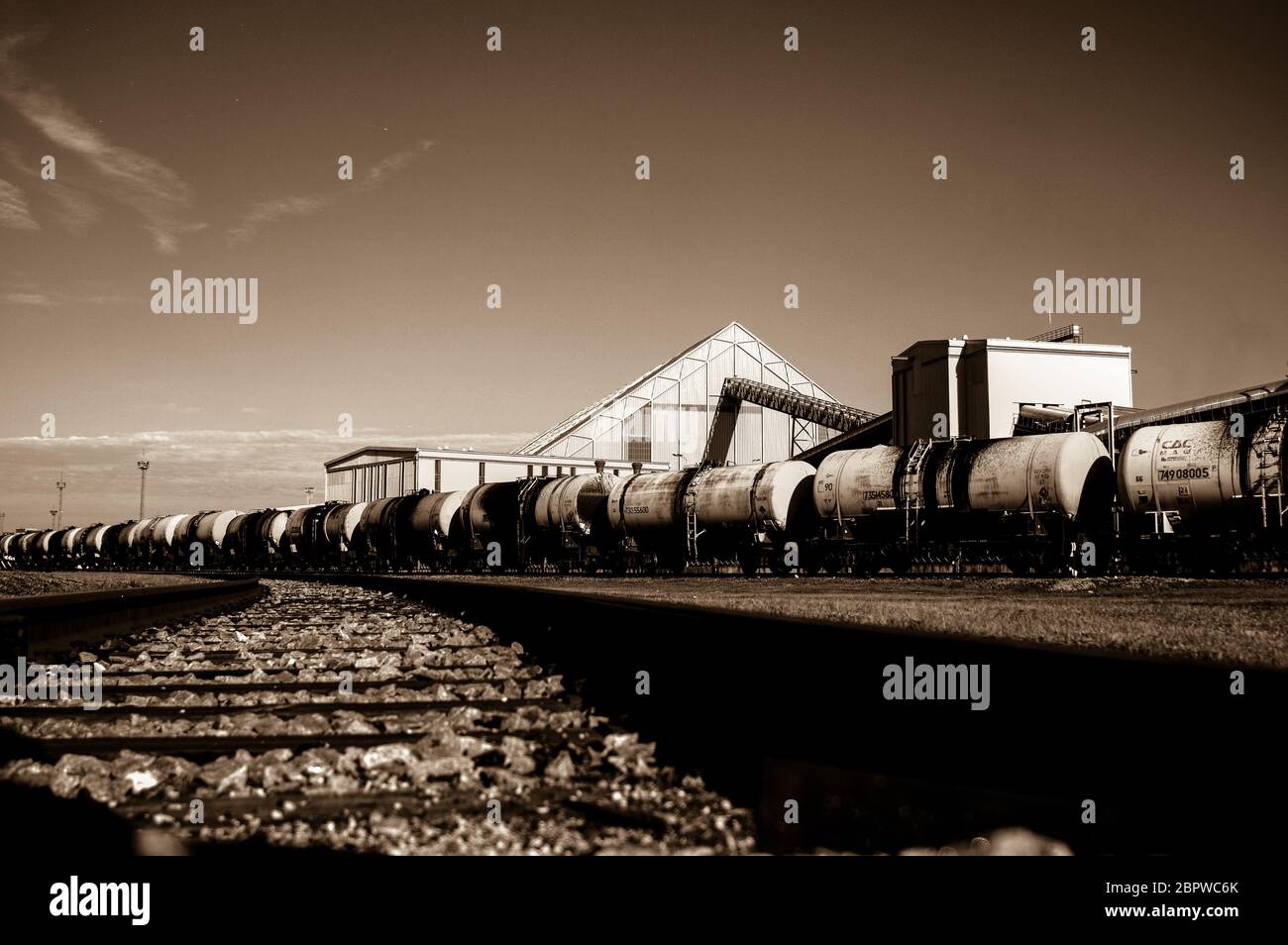 Oil train wagons on oil refinery Stock Photo - Alamy