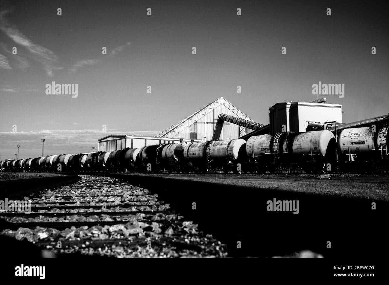 Oil train wagons on oil refinery Stock Photo - Alamy