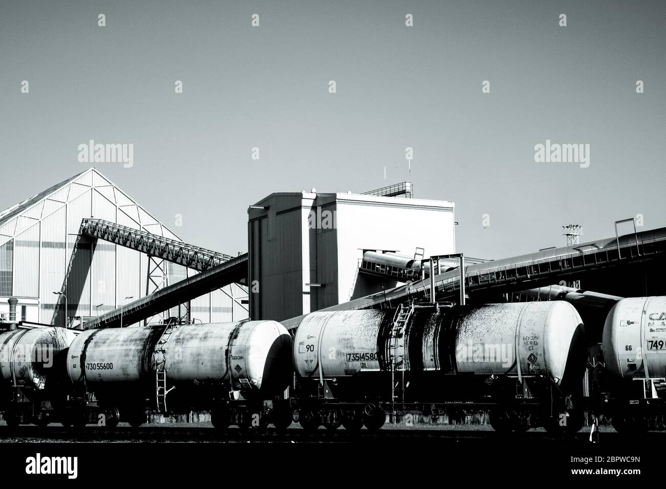 Oil train wagons on oil refinery Stock Photo - Alamy