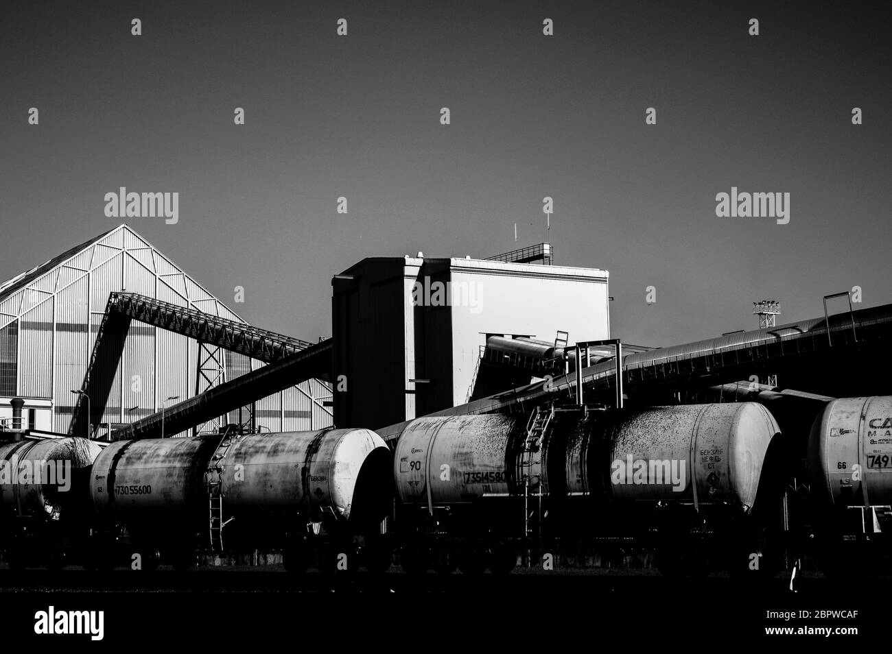 Oil train wagons on oil refinery Stock Photo - Alamy