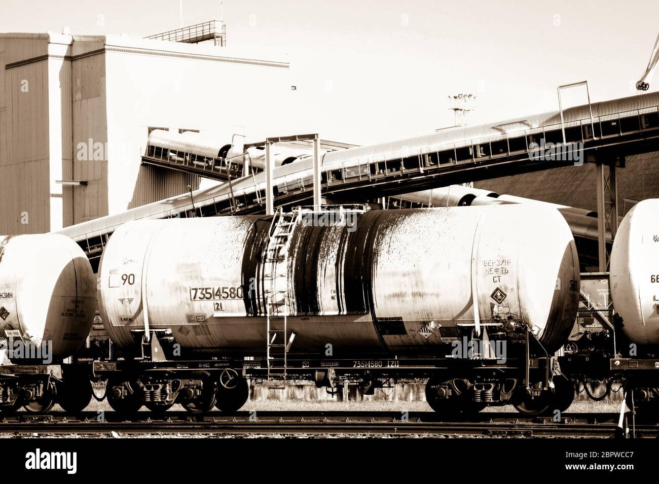 Oil train wagons on oil refinery Stock Photo - Alamy