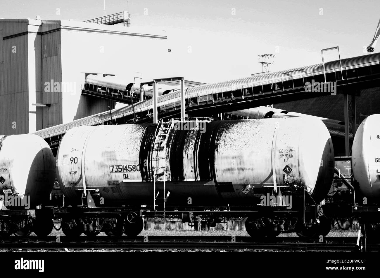 Oil train wagons on oil refinery Stock Photo - Alamy
