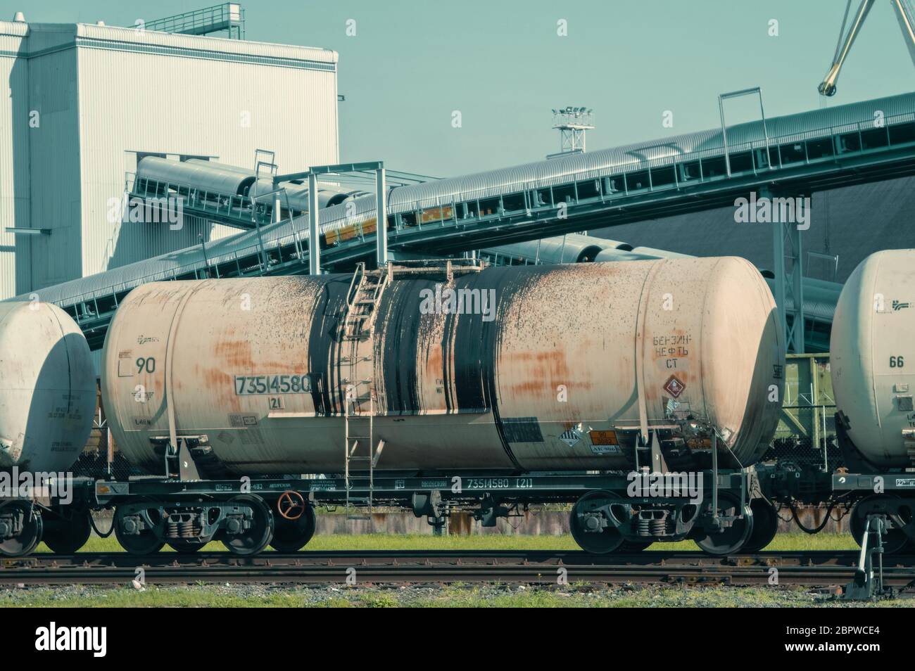 Oil train wagons on oil refinery Stock Photo - Alamy