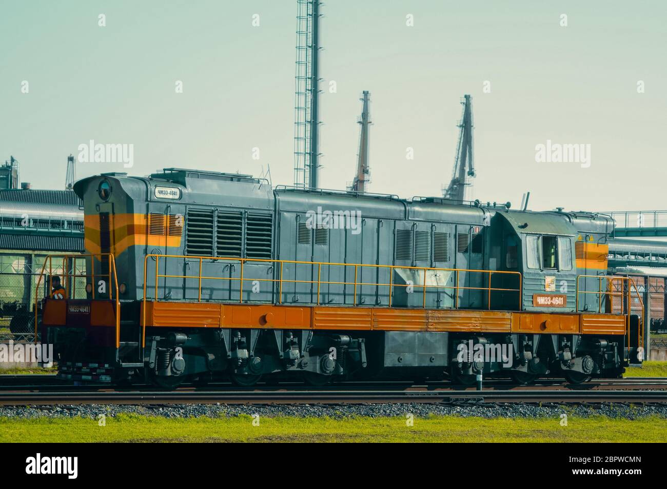Oil train wagons on oil refinery Stock Photo - Alamy