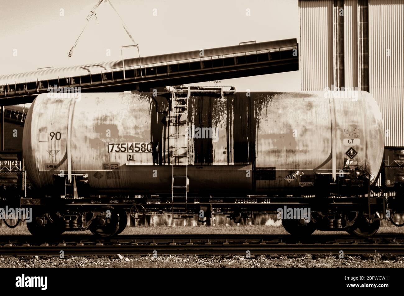 Oil train wagons on oil refinery Stock Photo - Alamy