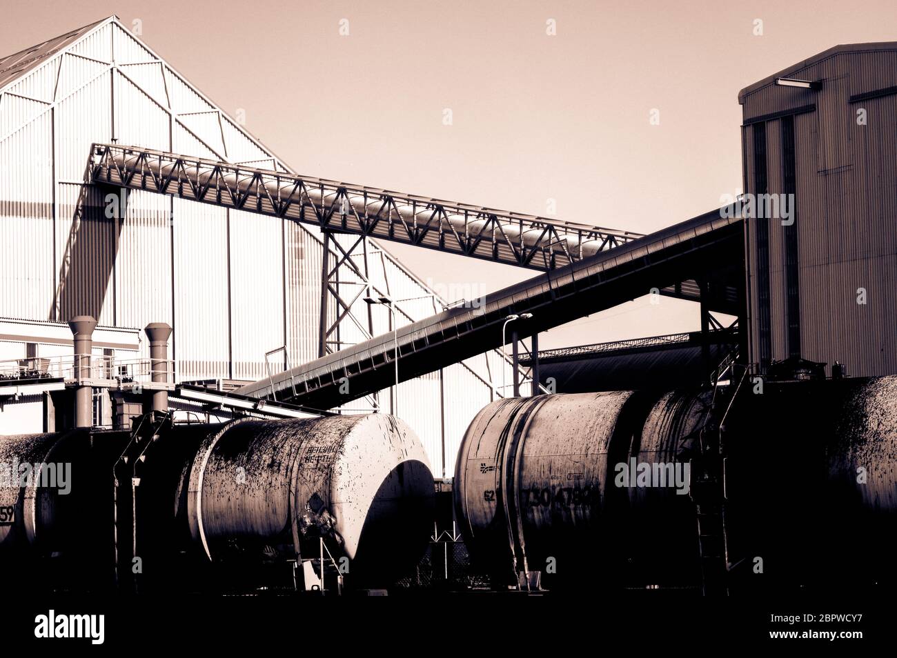 Oil train wagons on oil refinery Stock Photo - Alamy