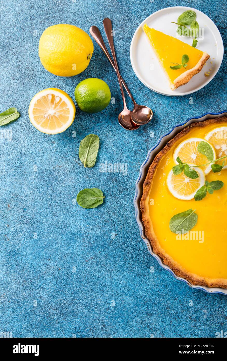 Food concept Homemade organic Lemon, lime tarts or cake pie on blue ...