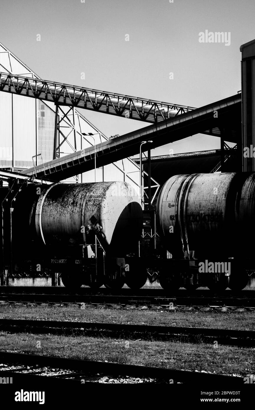 Oil train wagons on oil refinery Stock Photo - Alamy