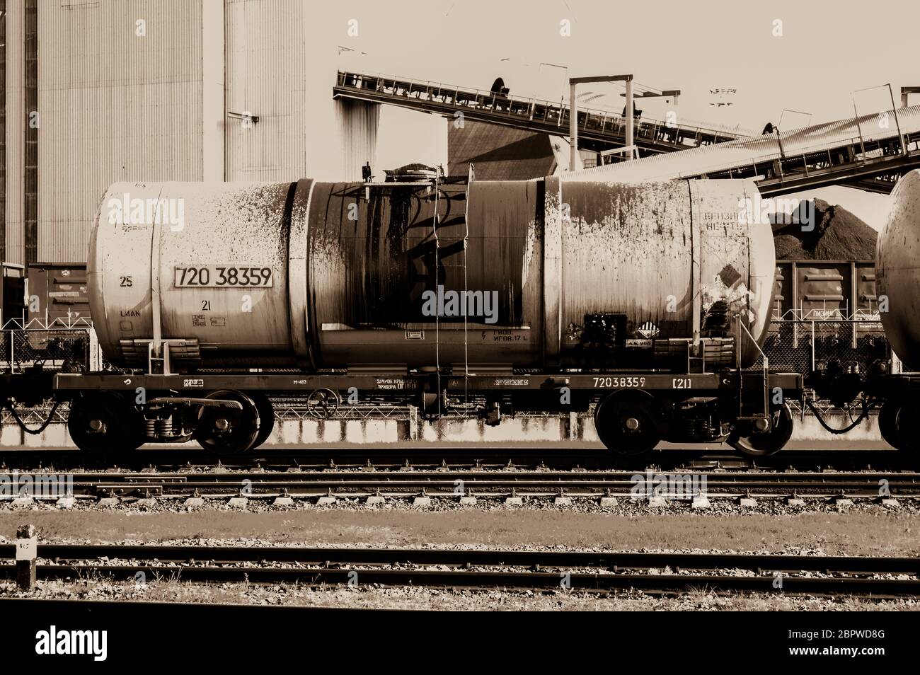 Oil train wagons on oil refinery Stock Photo - Alamy