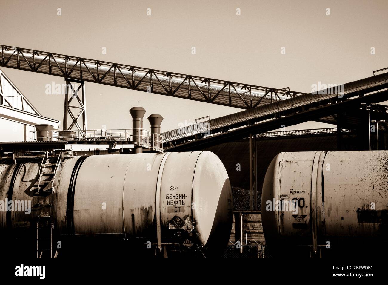 Oil train wagons on oil refinery Stock Photo - Alamy