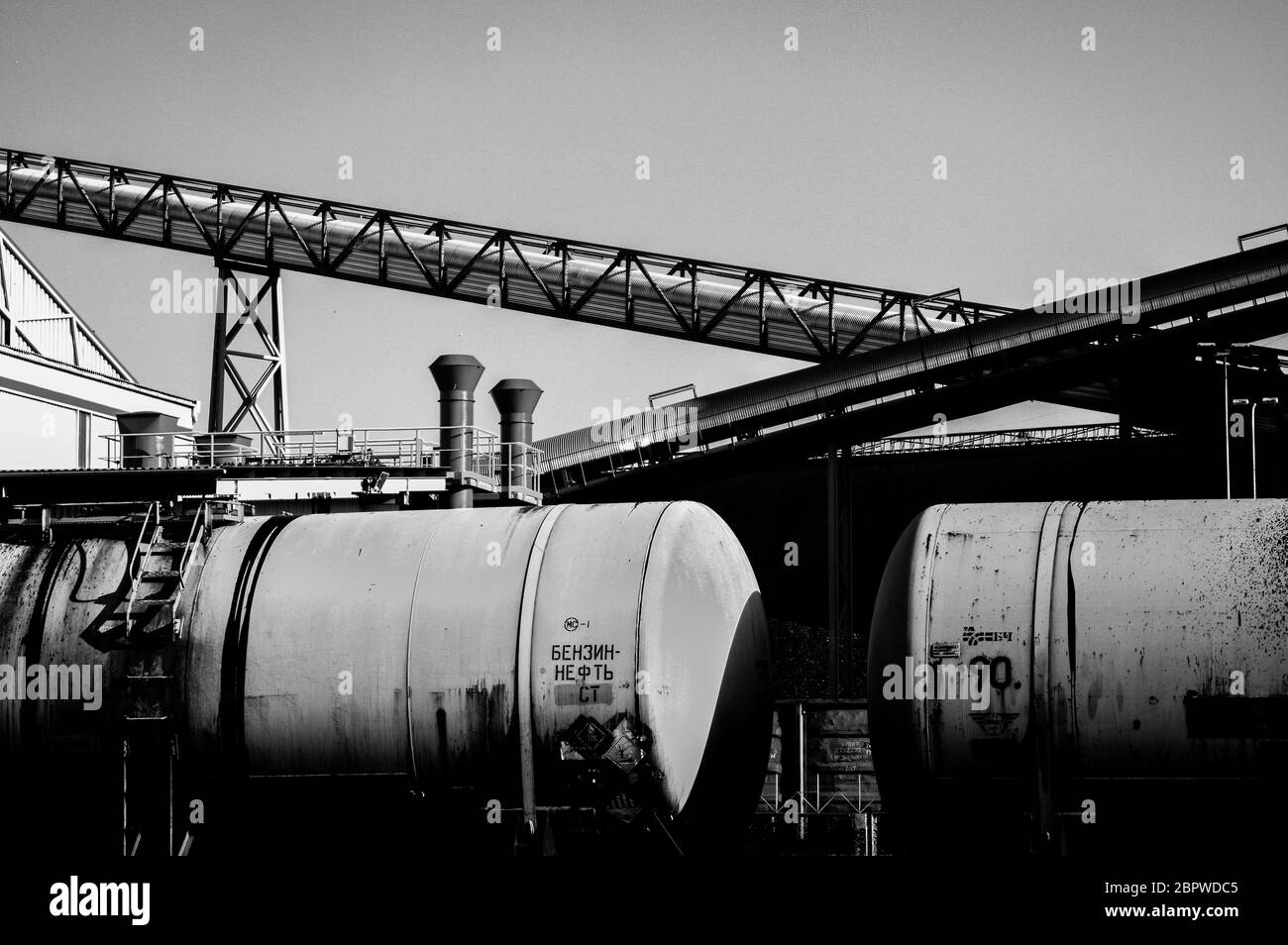 Oil train wagons on oil refinery Stock Photo - Alamy