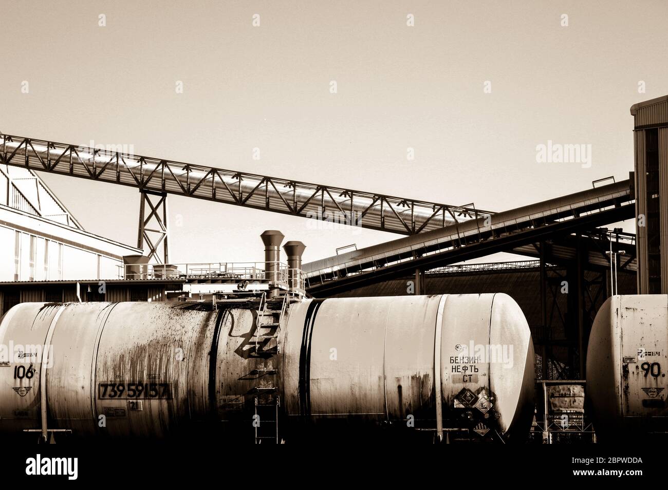 Oil train wagons on oil refinery Stock Photo - Alamy