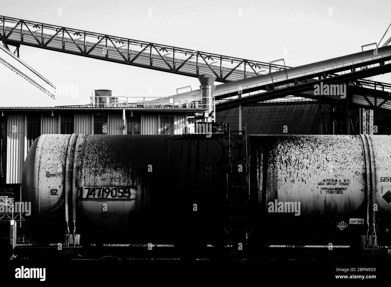 Oil train wagons on oil refinery Stock Photo - Alamy