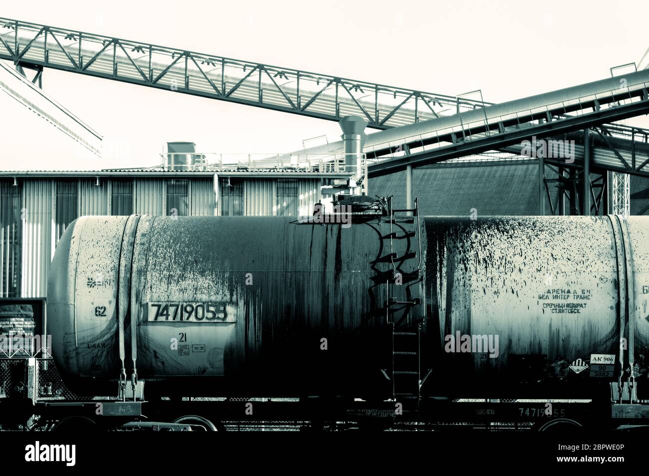 Oil train wagons on oil refinery Stock Photo - Alamy