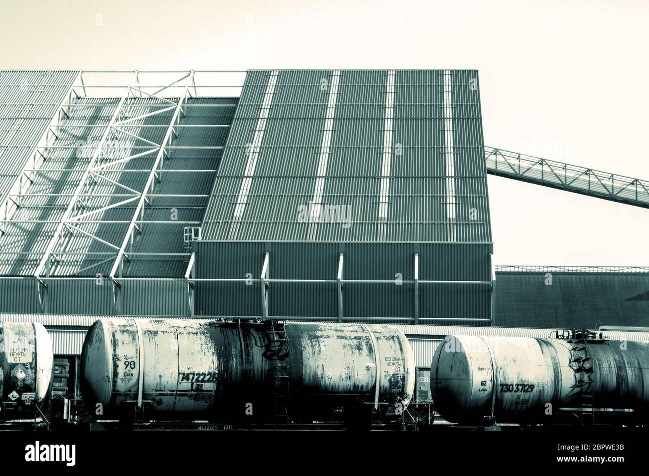 Oil train wagons on oil refinery Stock Photo - Alamy