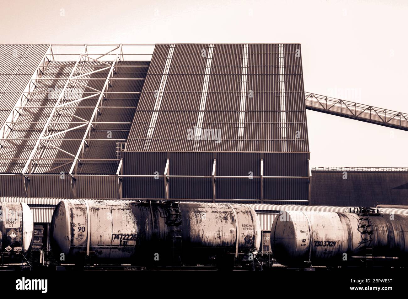 Oil train wagons on oil refinery Stock Photo - Alamy