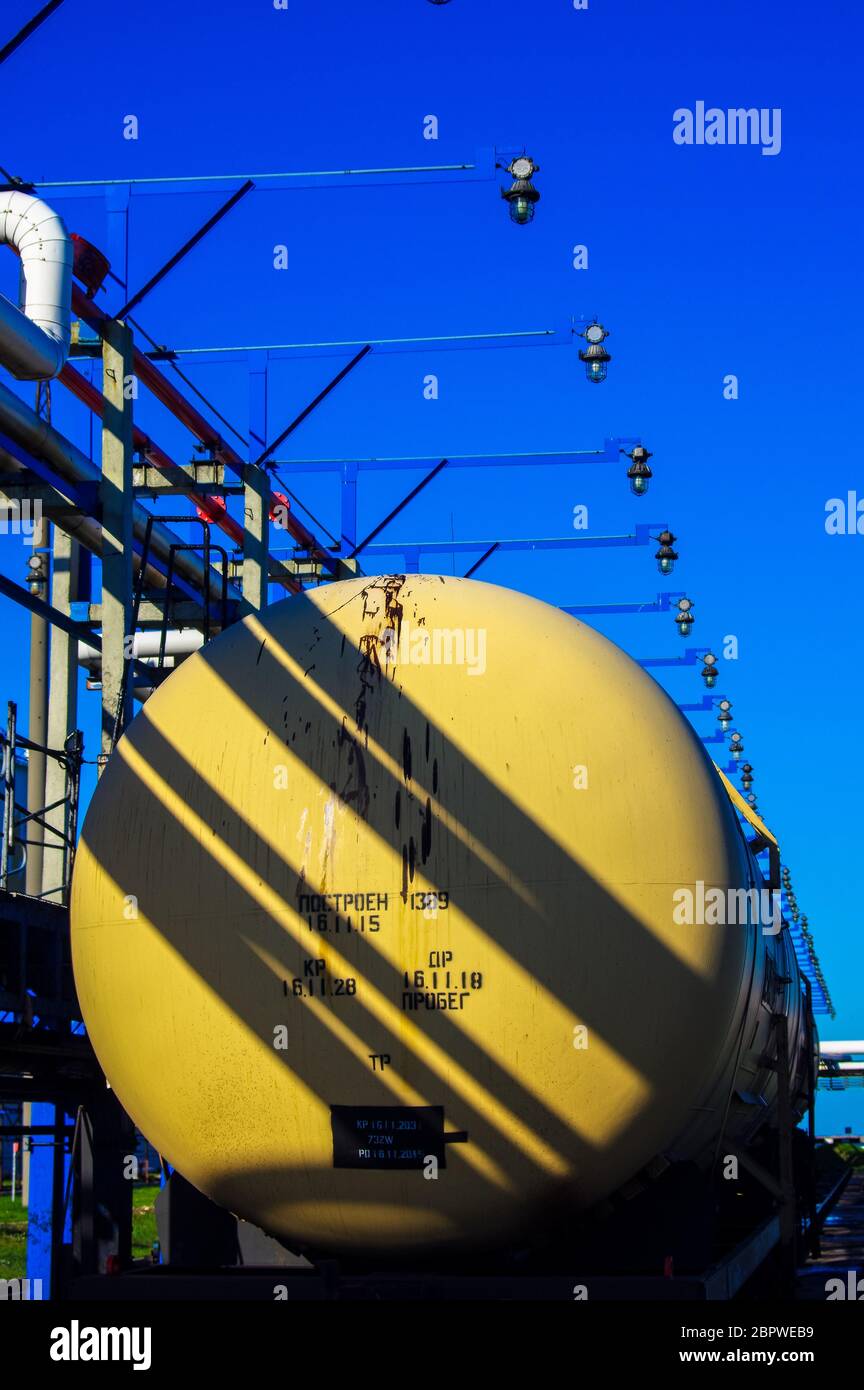 Oil train wagons on oil refinery Stock Photo - Alamy