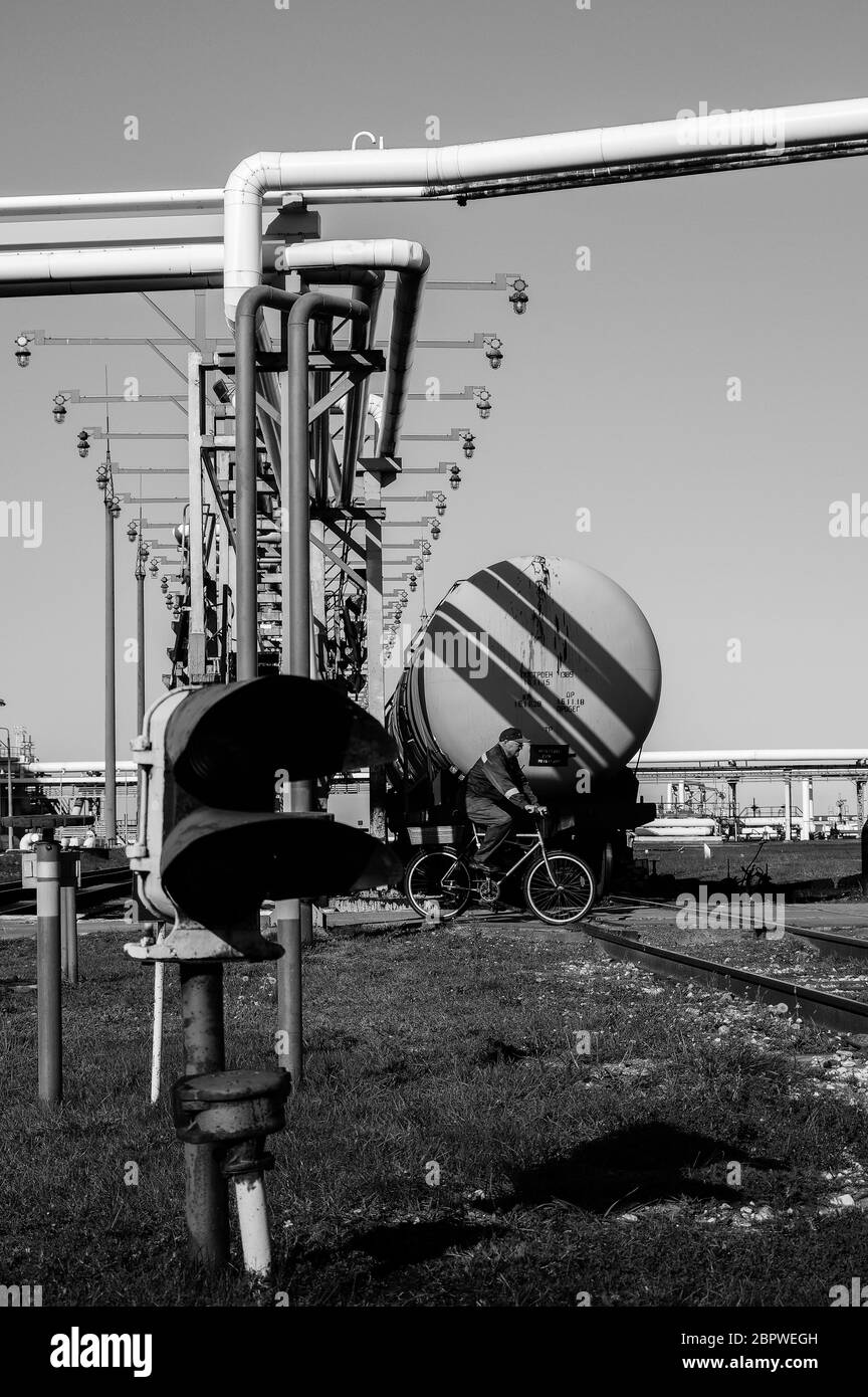 Oil train wagons on oil refinery Stock Photo - Alamy