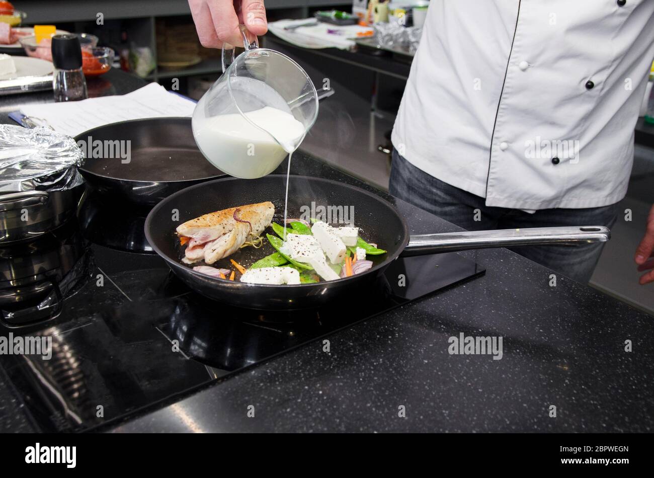 Chef dishes up meal hi-res stock photography and images - Alamy
