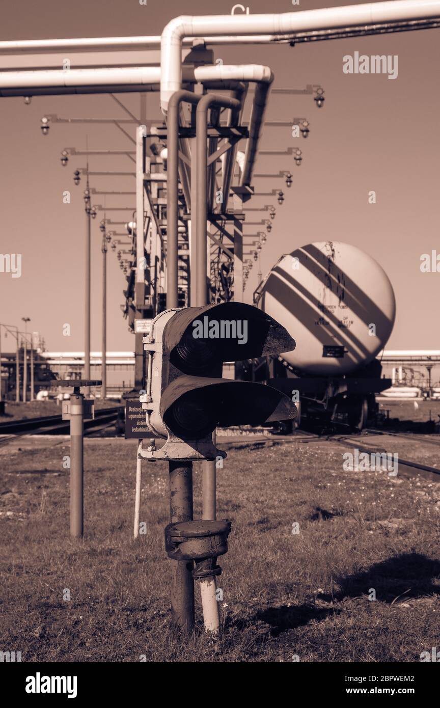 Oil train wagons on oil refinery Stock Photo - Alamy