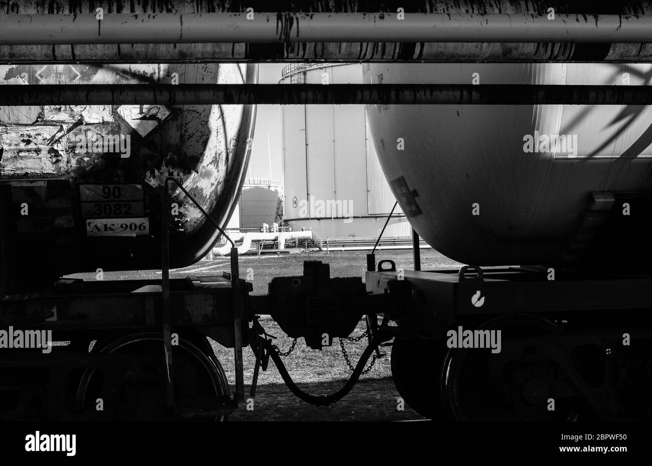 Oil train wagons on oil refinery Stock Photo - Alamy