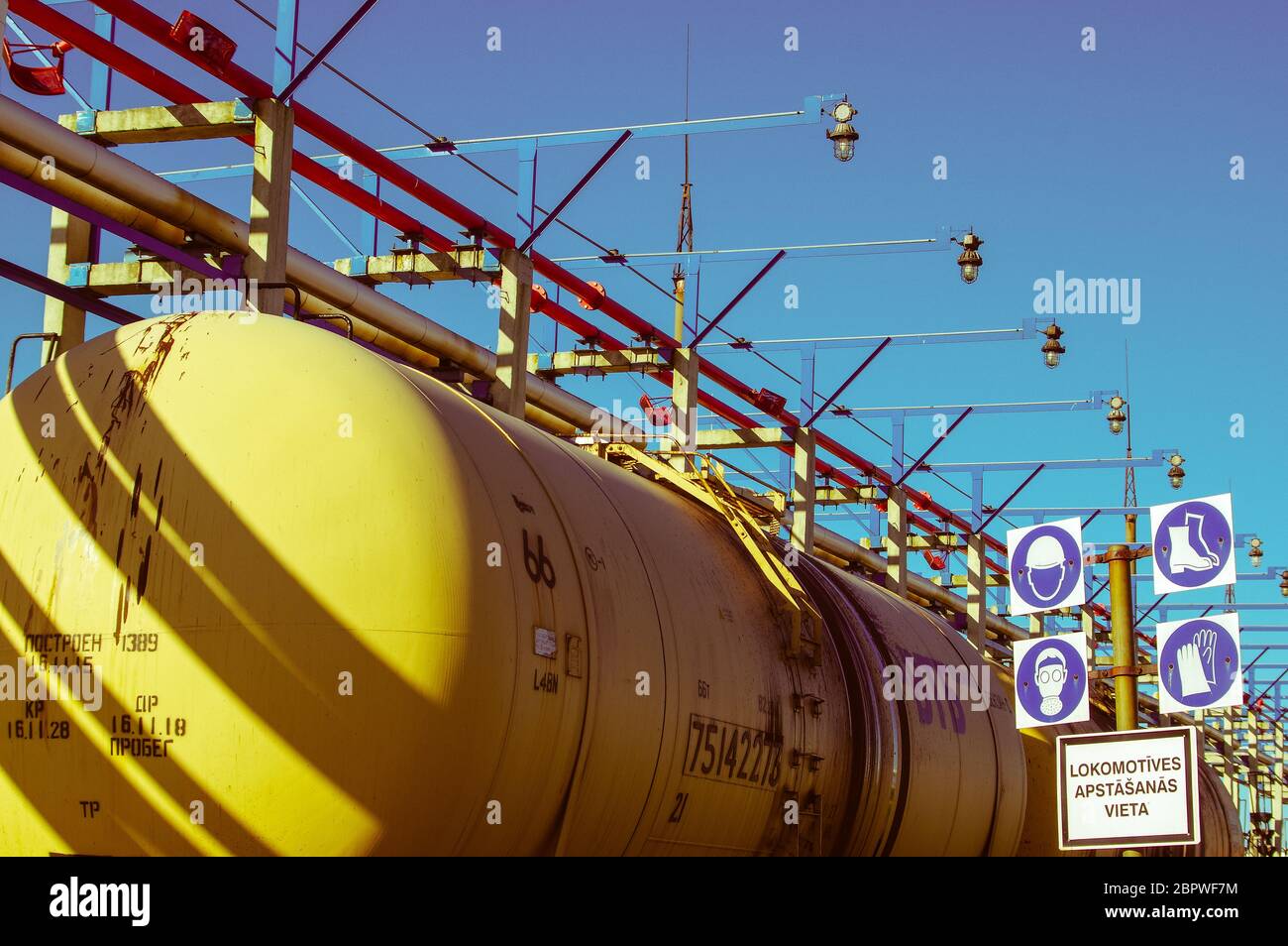 Oil train wagons on oil refinery Stock Photo - Alamy