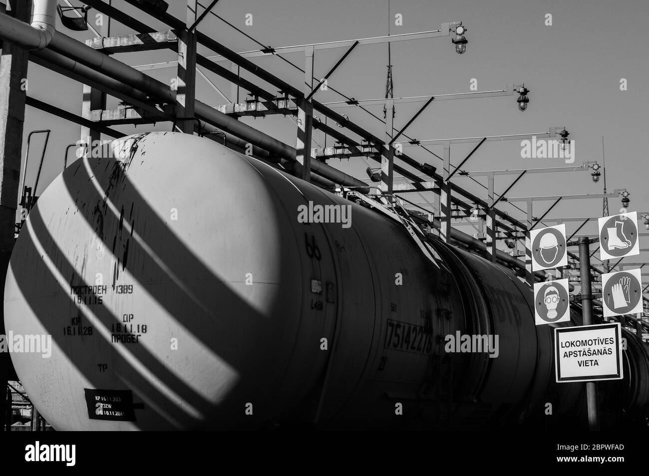 Oil train wagons on oil refinery Stock Photo - Alamy