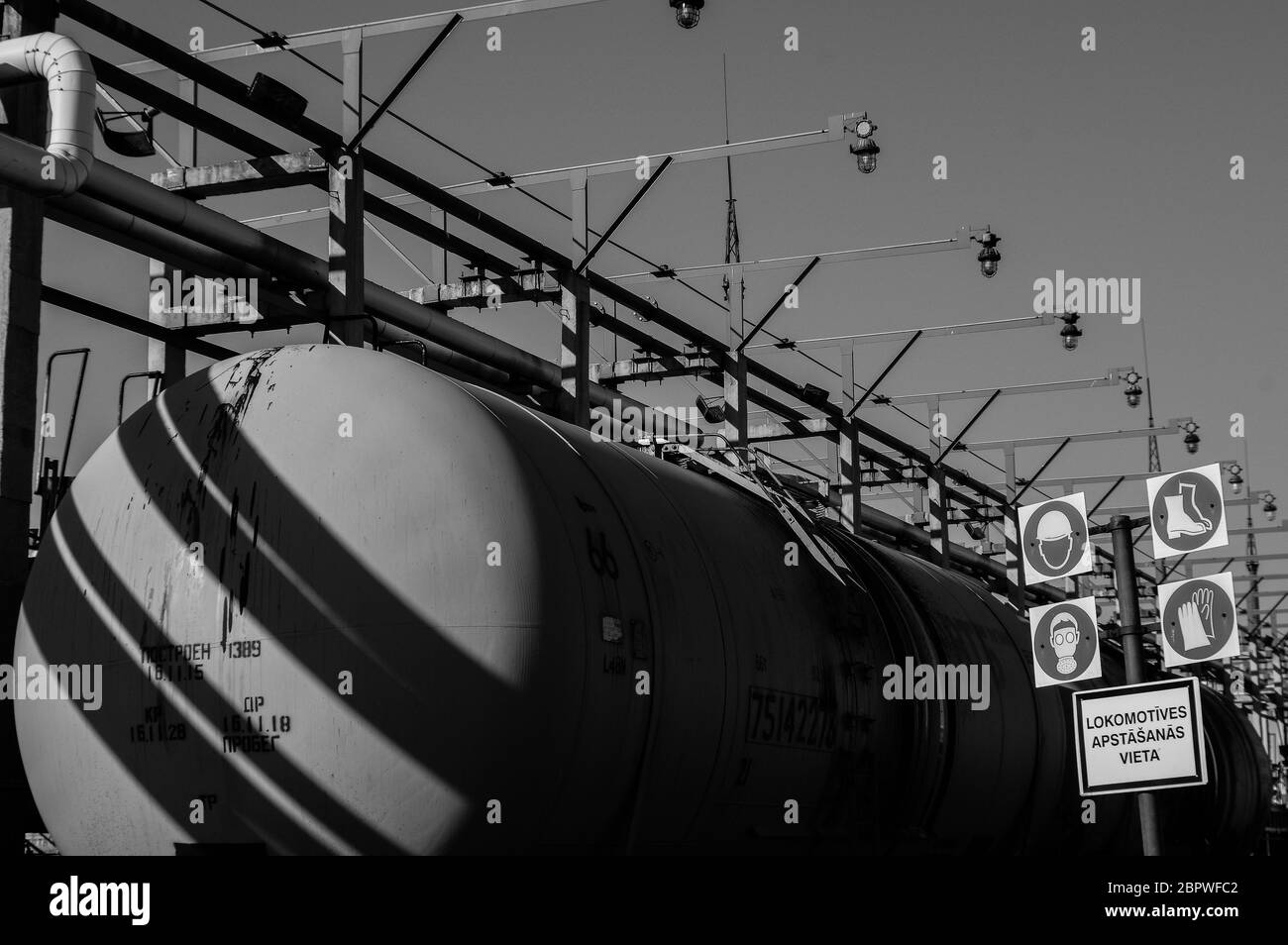 Oil train wagons on oil refinery Stock Photo - Alamy