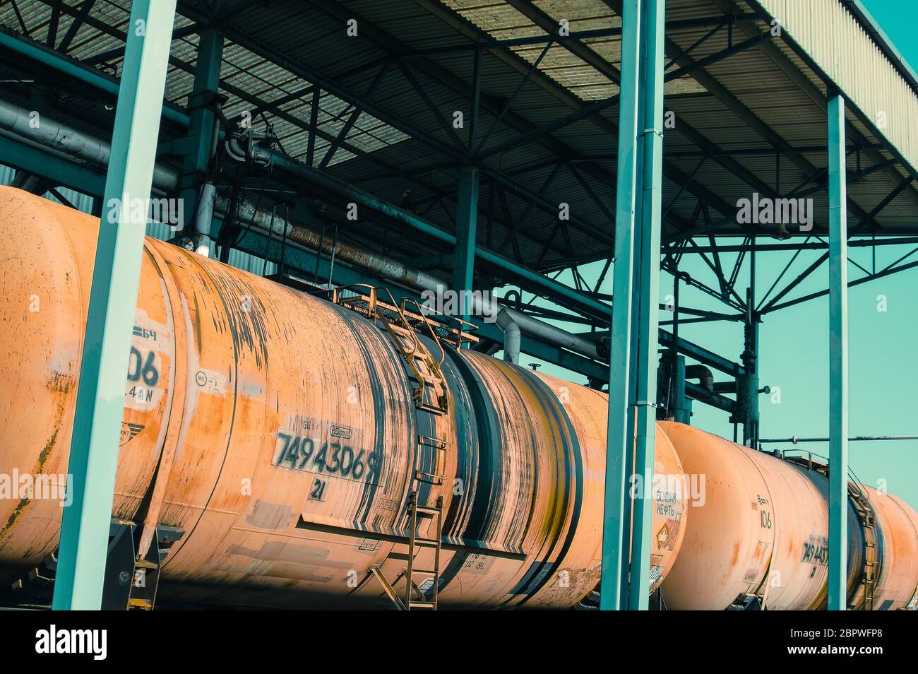 Oil train wagons on oil refinery Stock Photo - Alamy