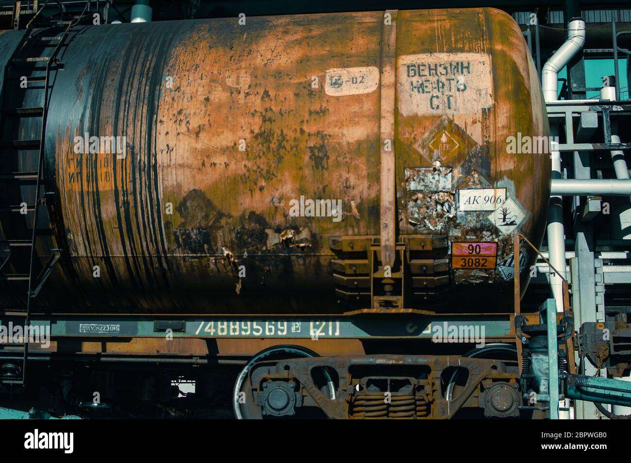 Oil train wagons on oil refinery Stock Photo - Alamy