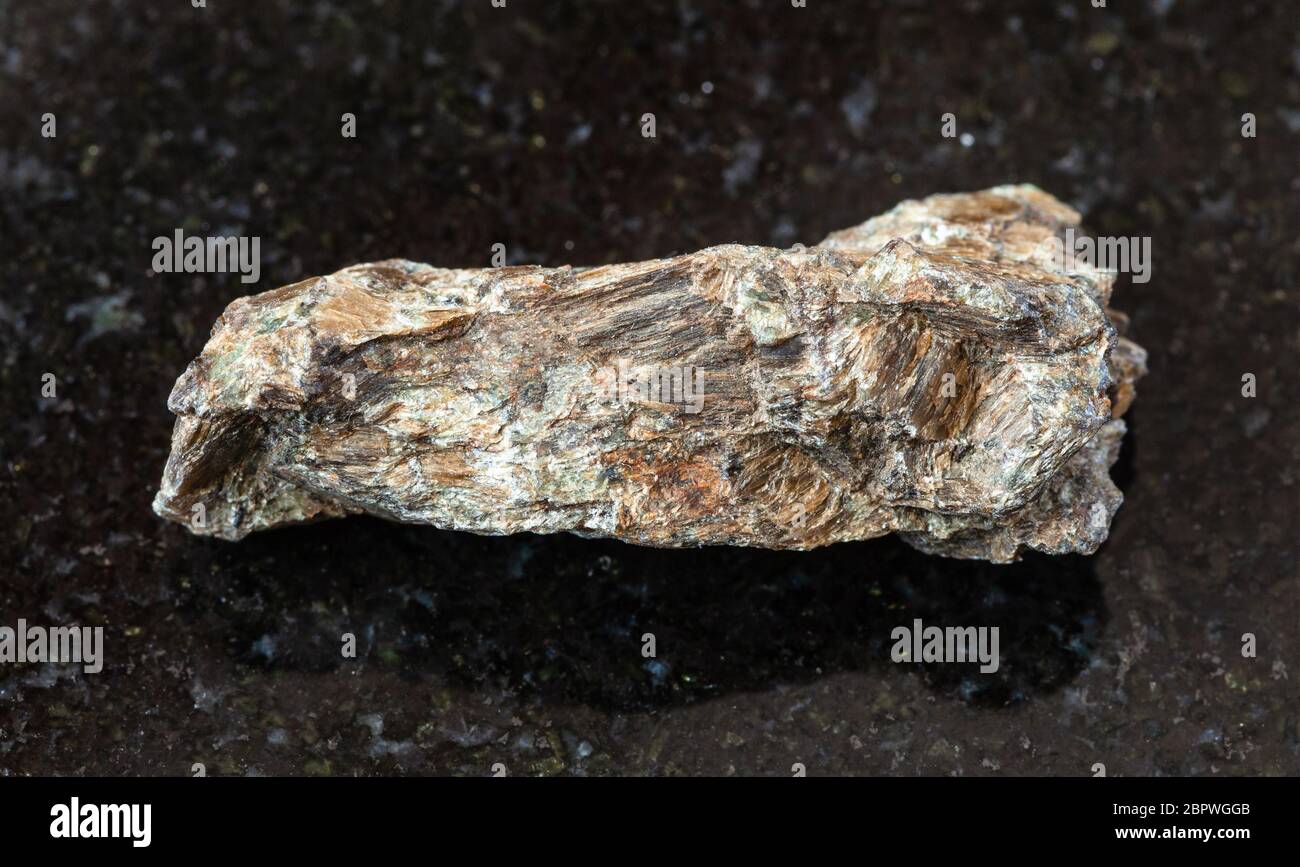 closeup of sample of natural mineral from geological collection - raw Bronzite (Enstatite) rock ...