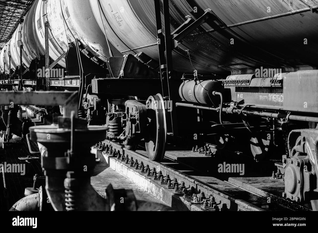 Oil train wagons on oil refinery Stock Photo - Alamy