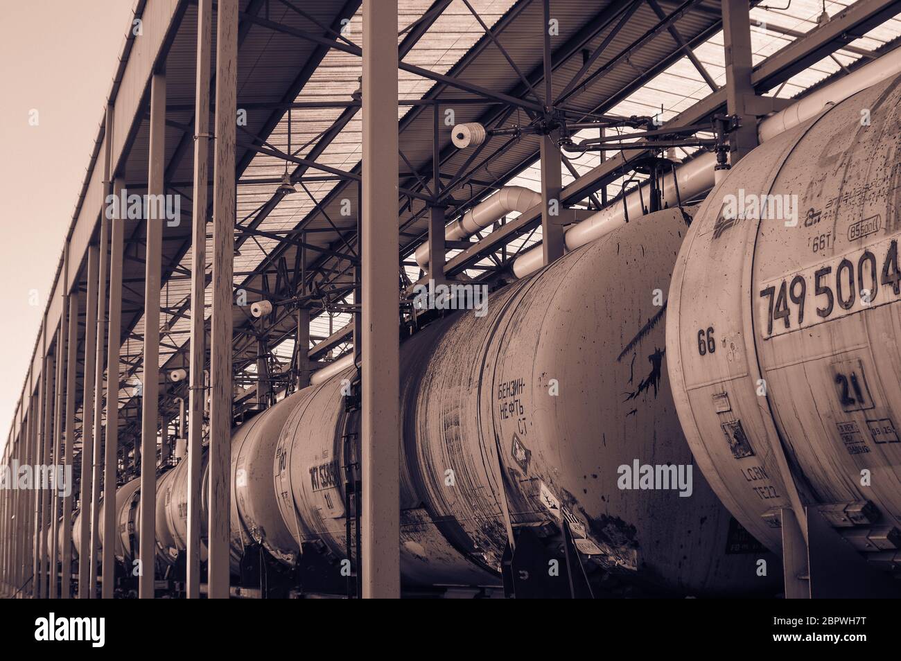 Oil train wagons on oil refinery Stock Photo - Alamy