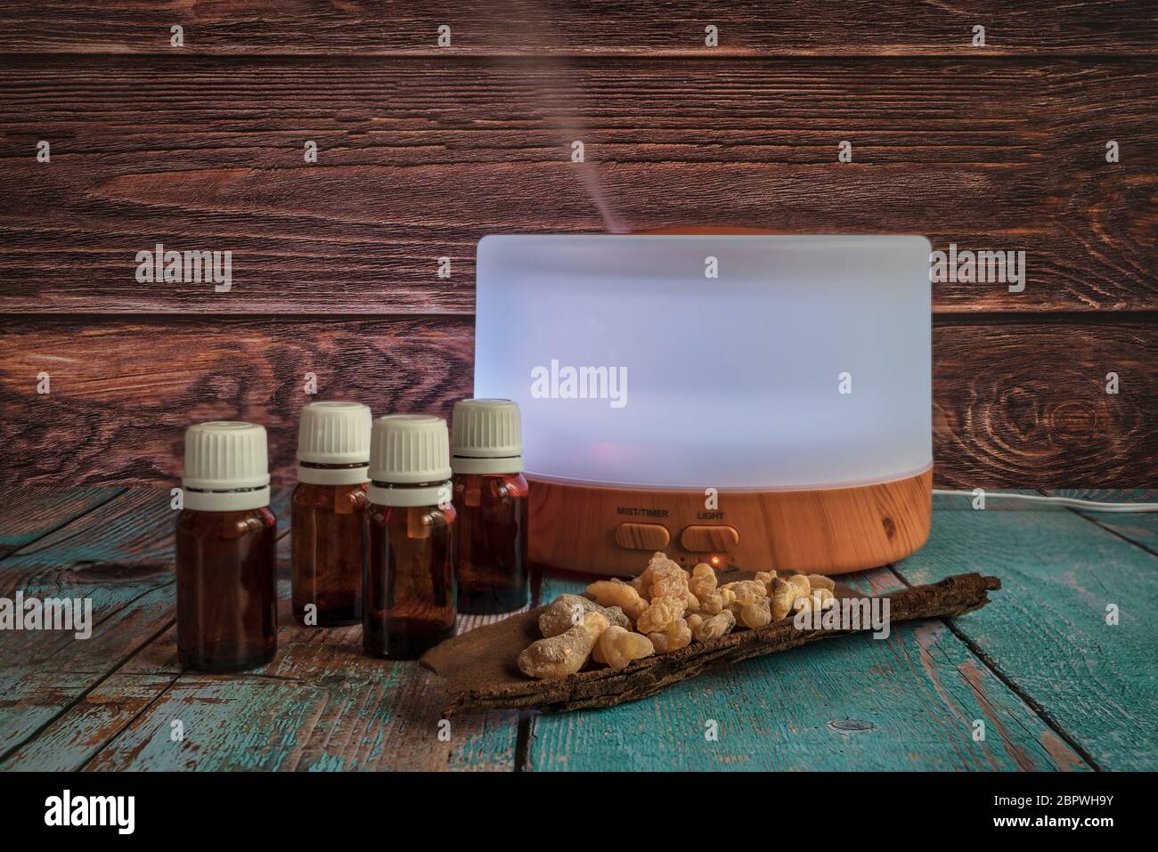 Electric oil diffuser with bottles and frankincense, horizontal format ...