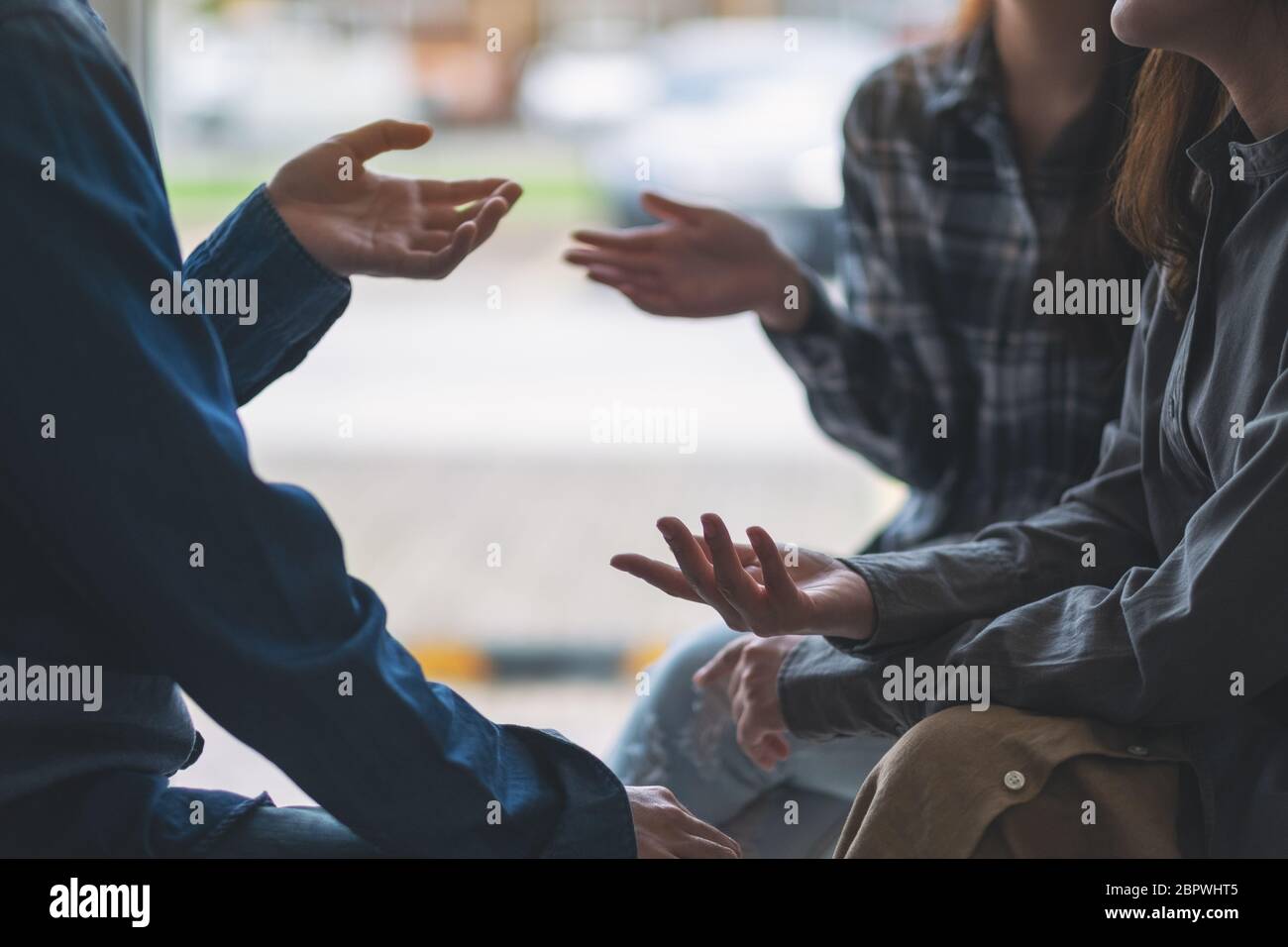 People sitting and talking together Stock Photo - Alamy