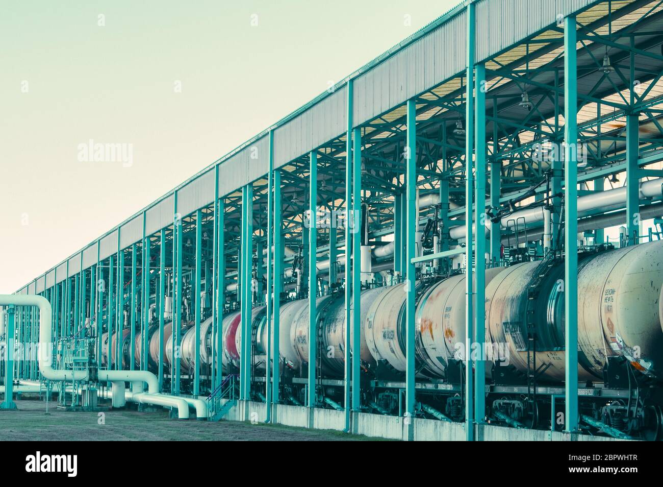 Oil train wagons on oil refinery Stock Photo - Alamy