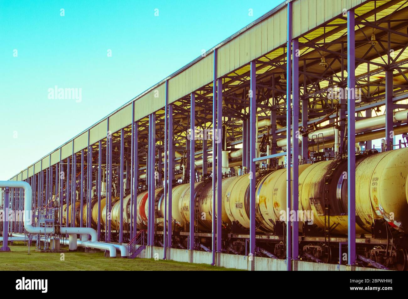 Oil train wagons on oil refinery Stock Photo - Alamy
