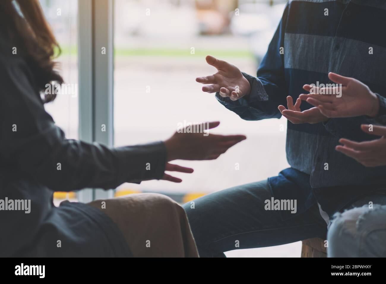 People sitting and talking together Stock Photo - Alamy