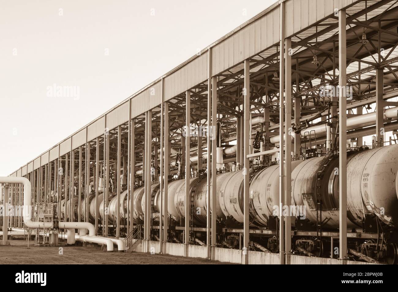 Oil train wagons on oil refinery Stock Photo - Alamy